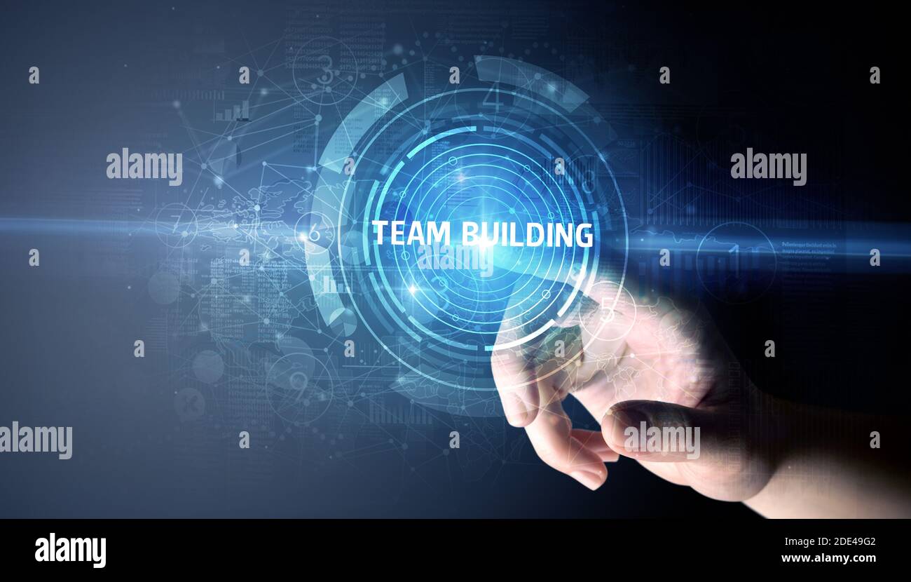 Hand touching TEAM BUILDING button, modern business technology concept ...