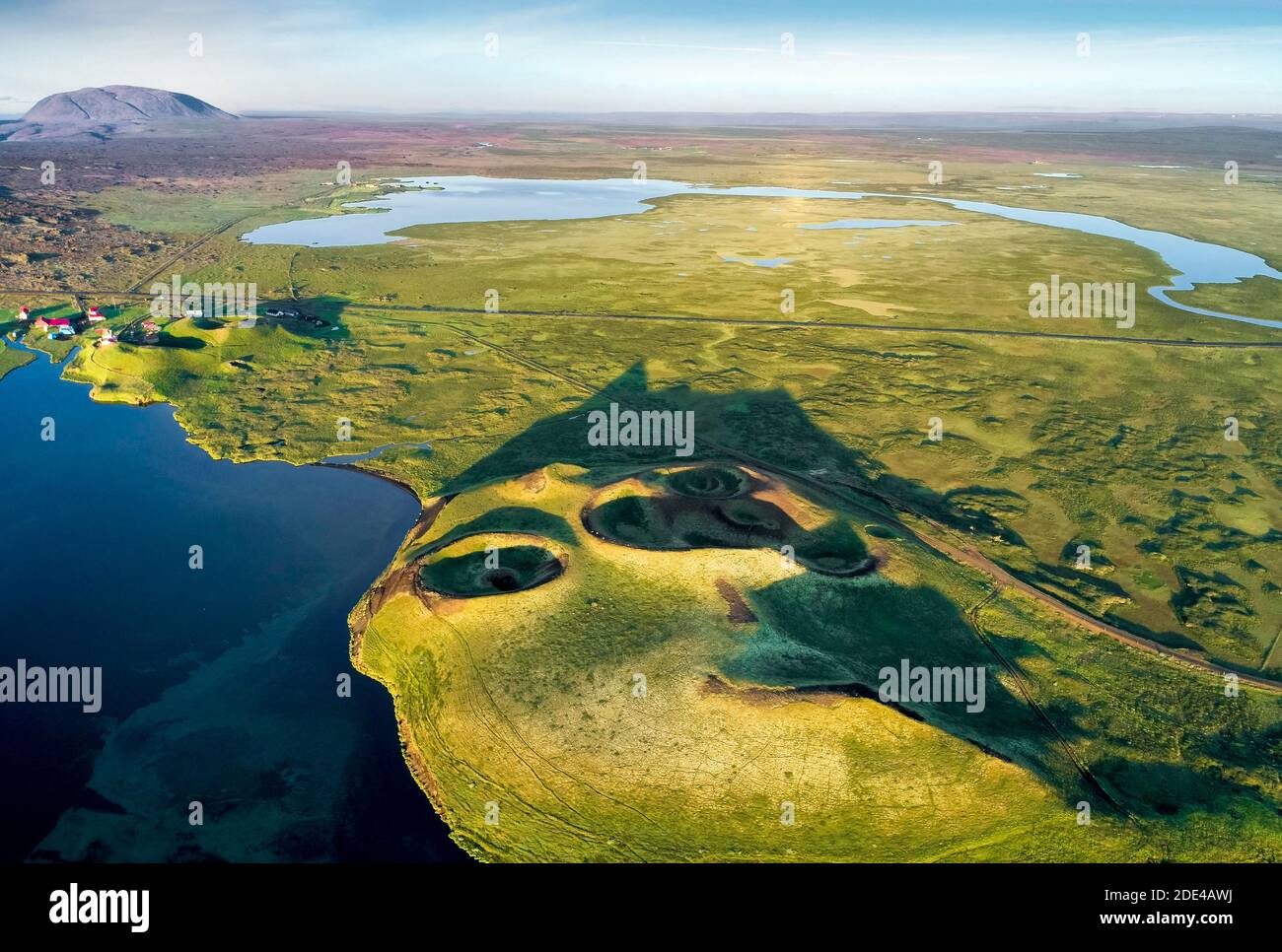 Aerial view of coast with green pseudo-craters, volcanic craters, small ...
