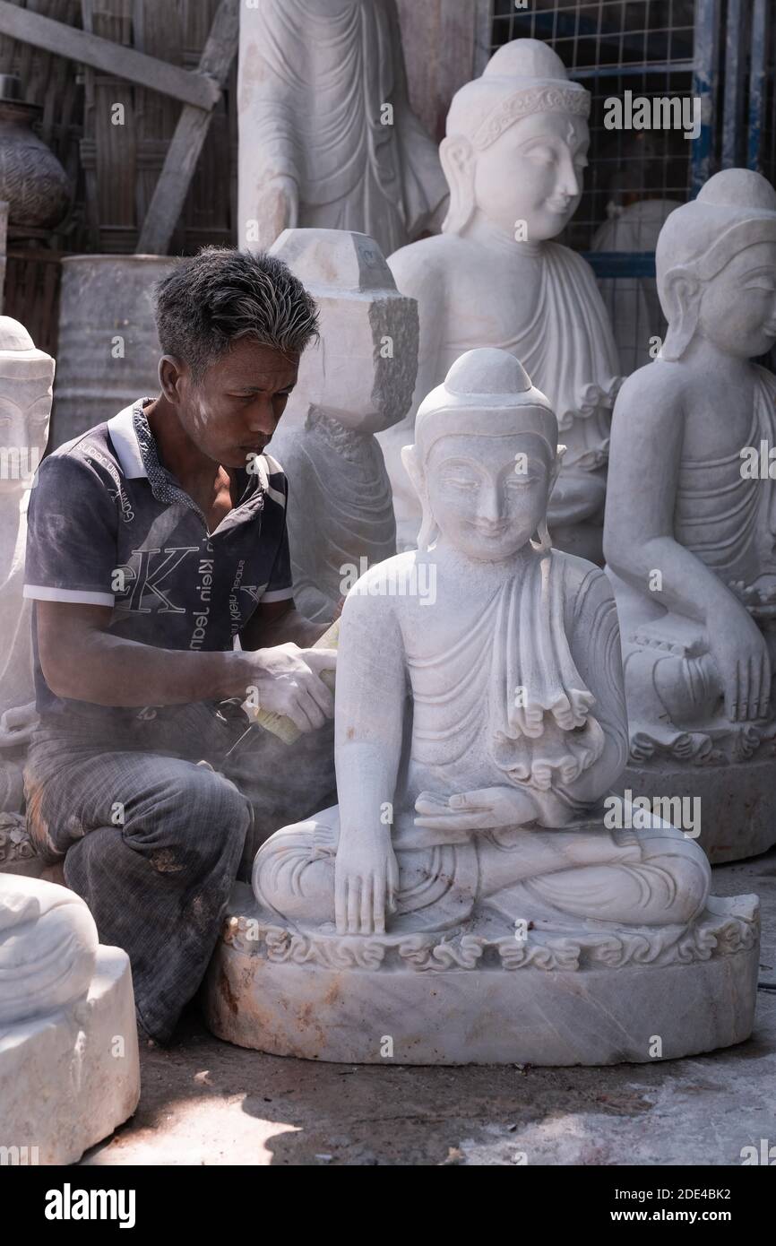Man makes white Buddhist statues, Mandalay, Myanmar Stock Photo - Alamy