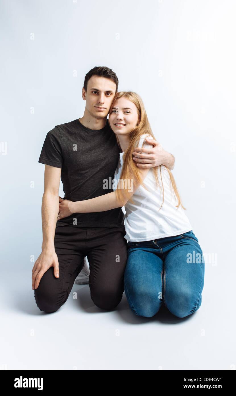 Young couple, husband and wife hugging and laughing together, happy ...