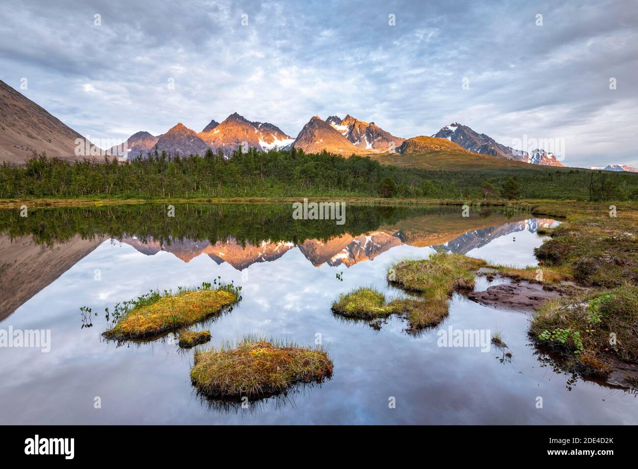 Mountains of the Lyngen Alps are reflected in the lake, Lyngenfjord ...