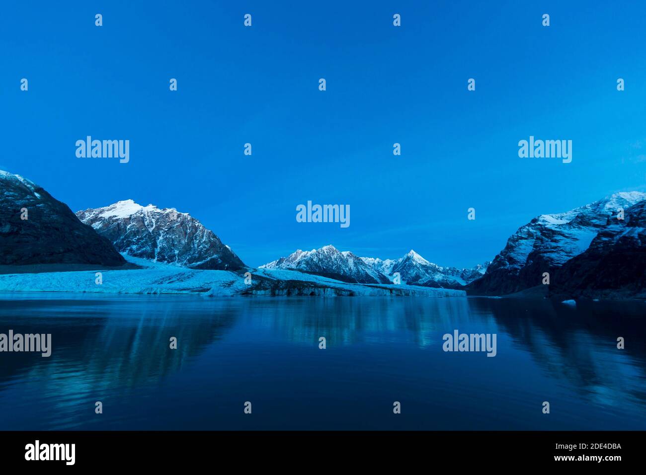 Evening mood at fjord, blue hour, glacier, east coast Greenland ...