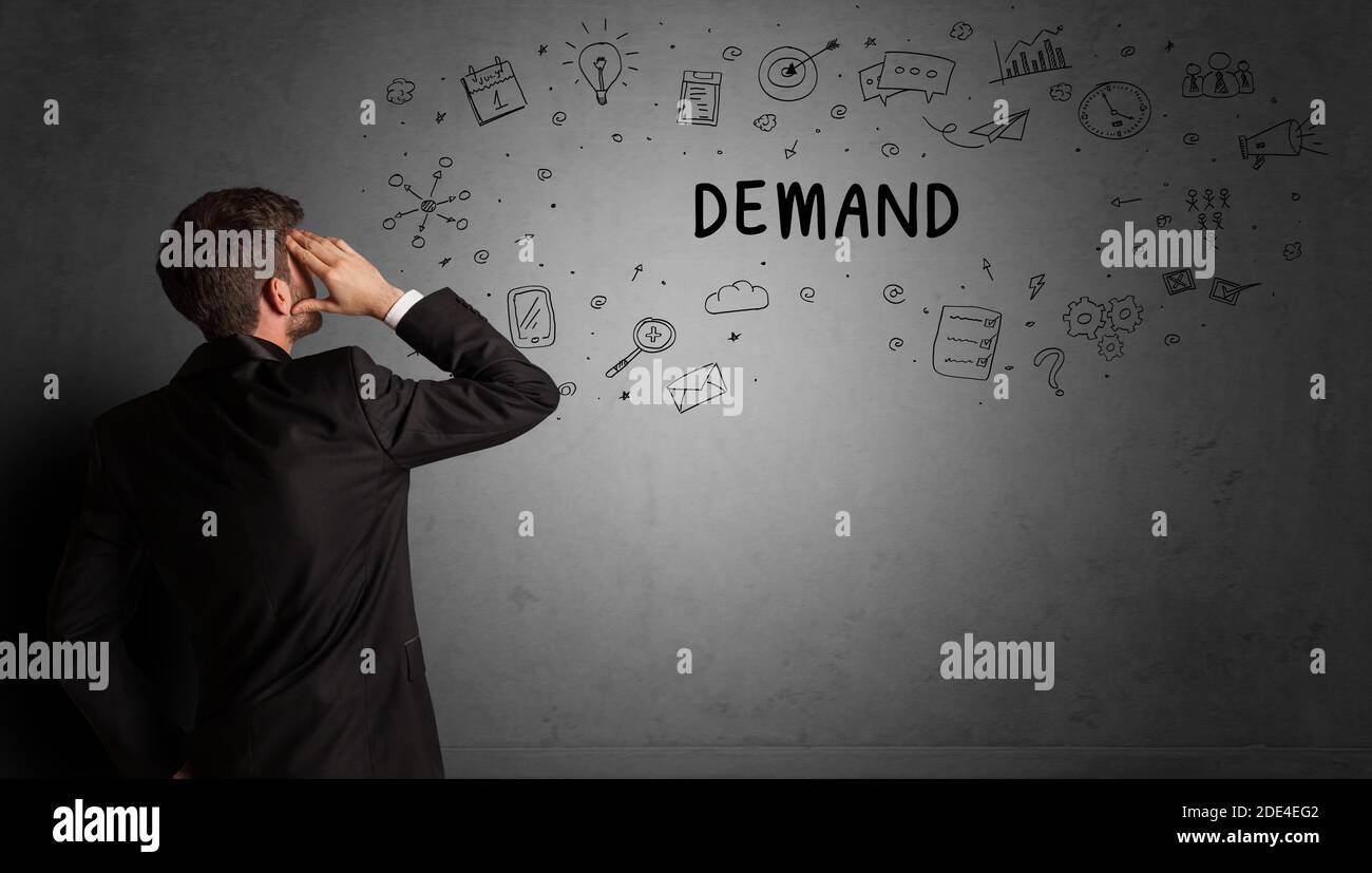 businessman drawing a creative idea sketch with DEMAND inscription ...