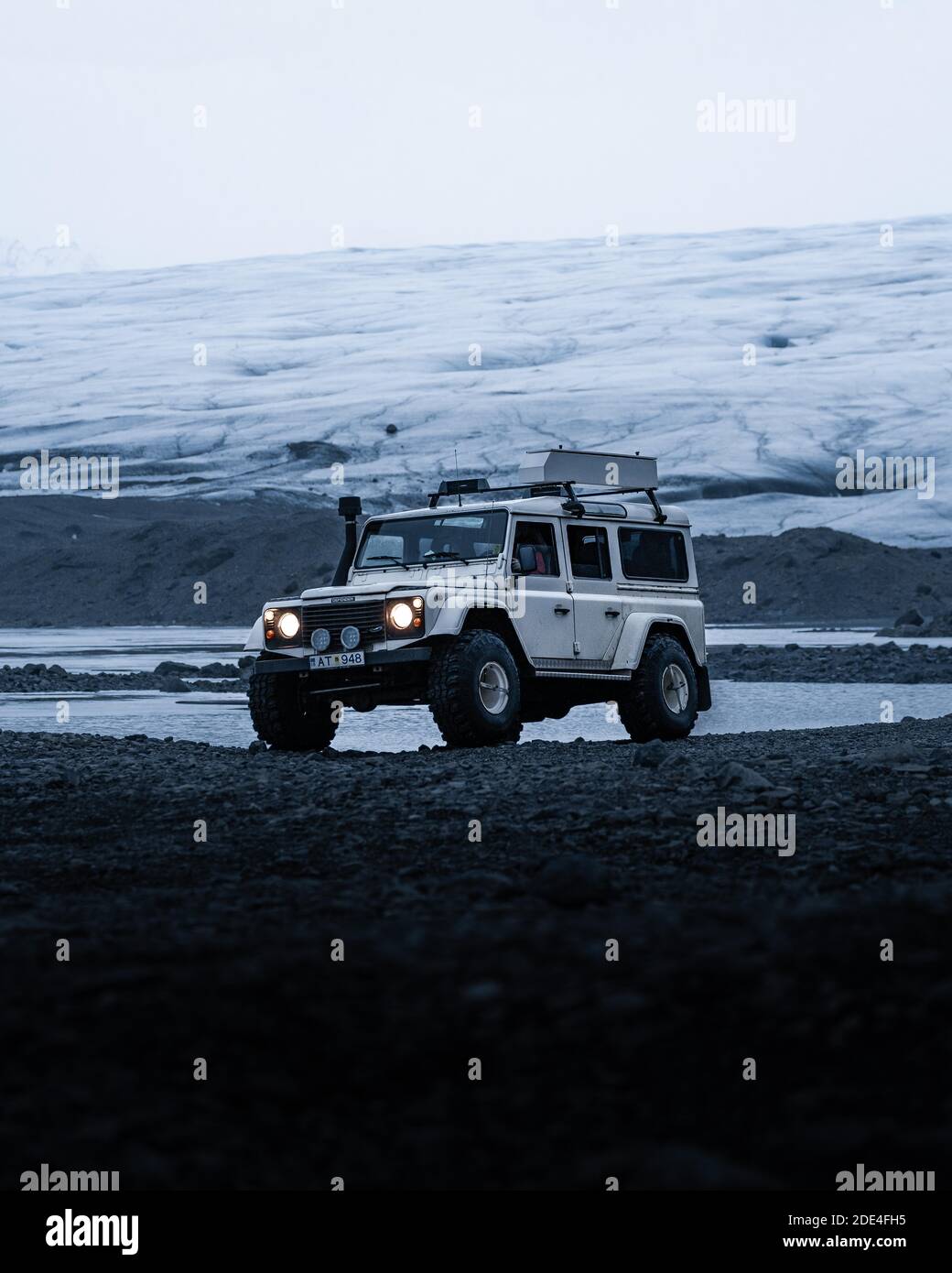 White Land Rover Jeep in front of a glacier, Vatnajoekull glacier ...