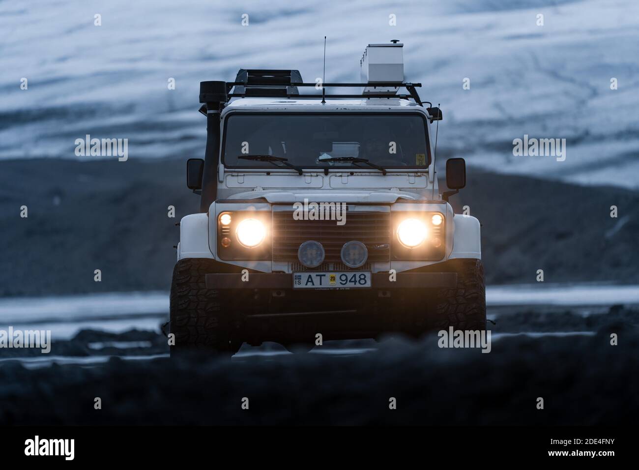 White Land Rover Jeep in front of a glacier, Vatnajoekull glacier ...