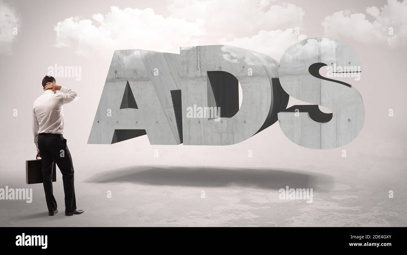 Rear view of a businessman standing in front of ADS abbreviation ...