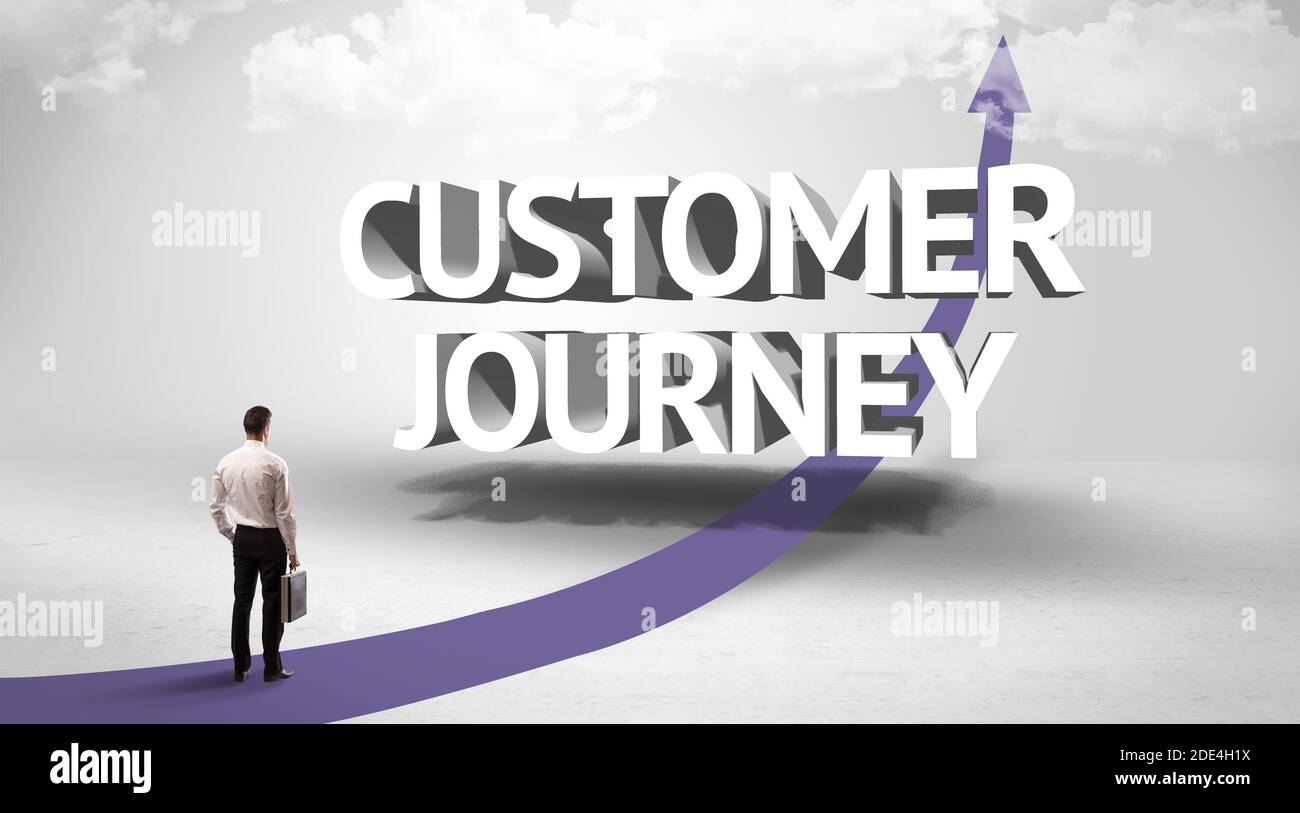 Rear view of a businessman standing in front of CUSTOMER JOURNEY ...