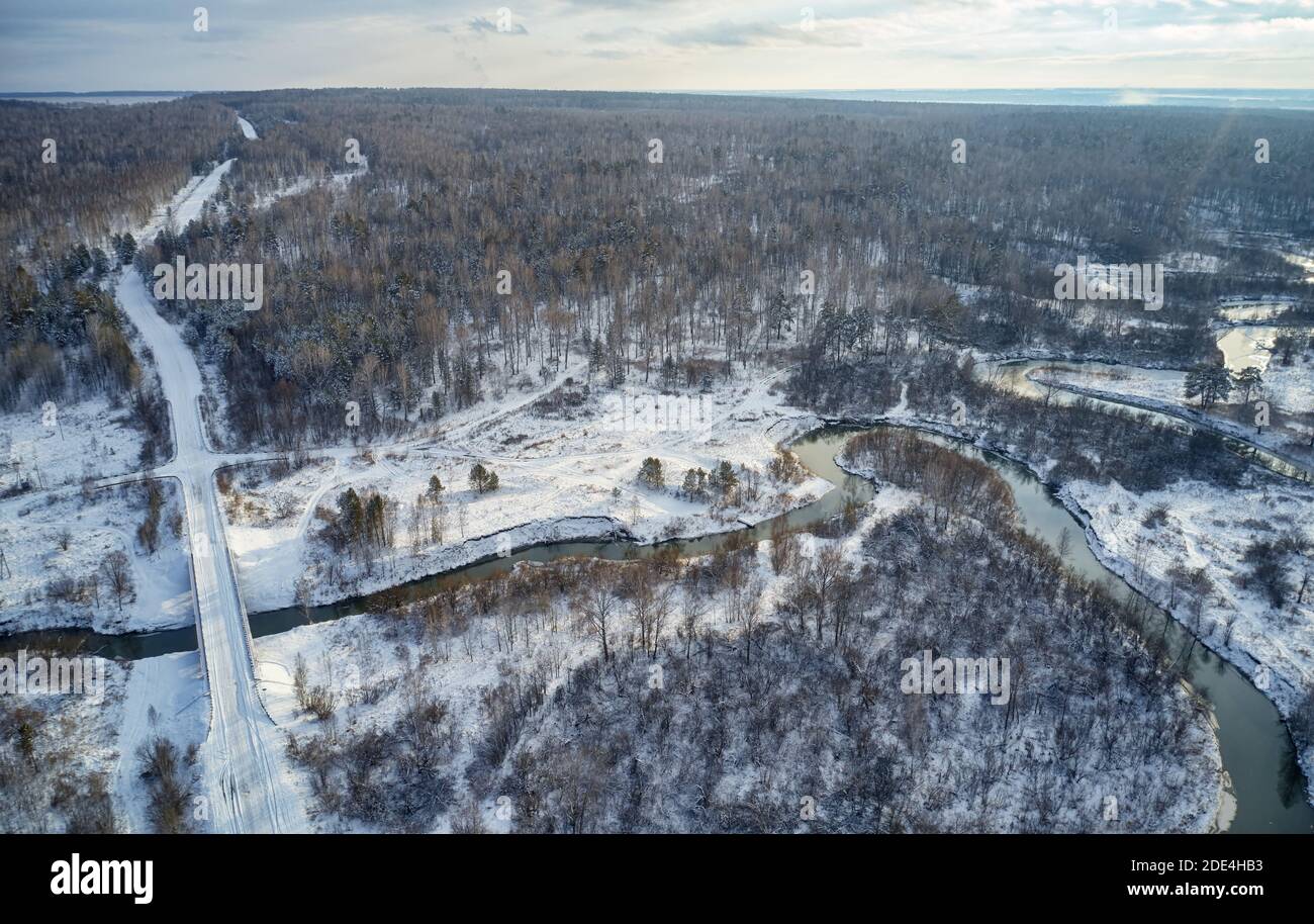 Aerial photo of Koen river and road bridge under ice and snow ...