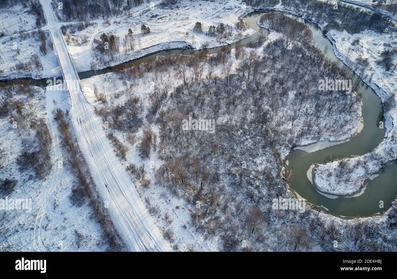 Aerial photo of Koen river and road bridge under ice and snow ...