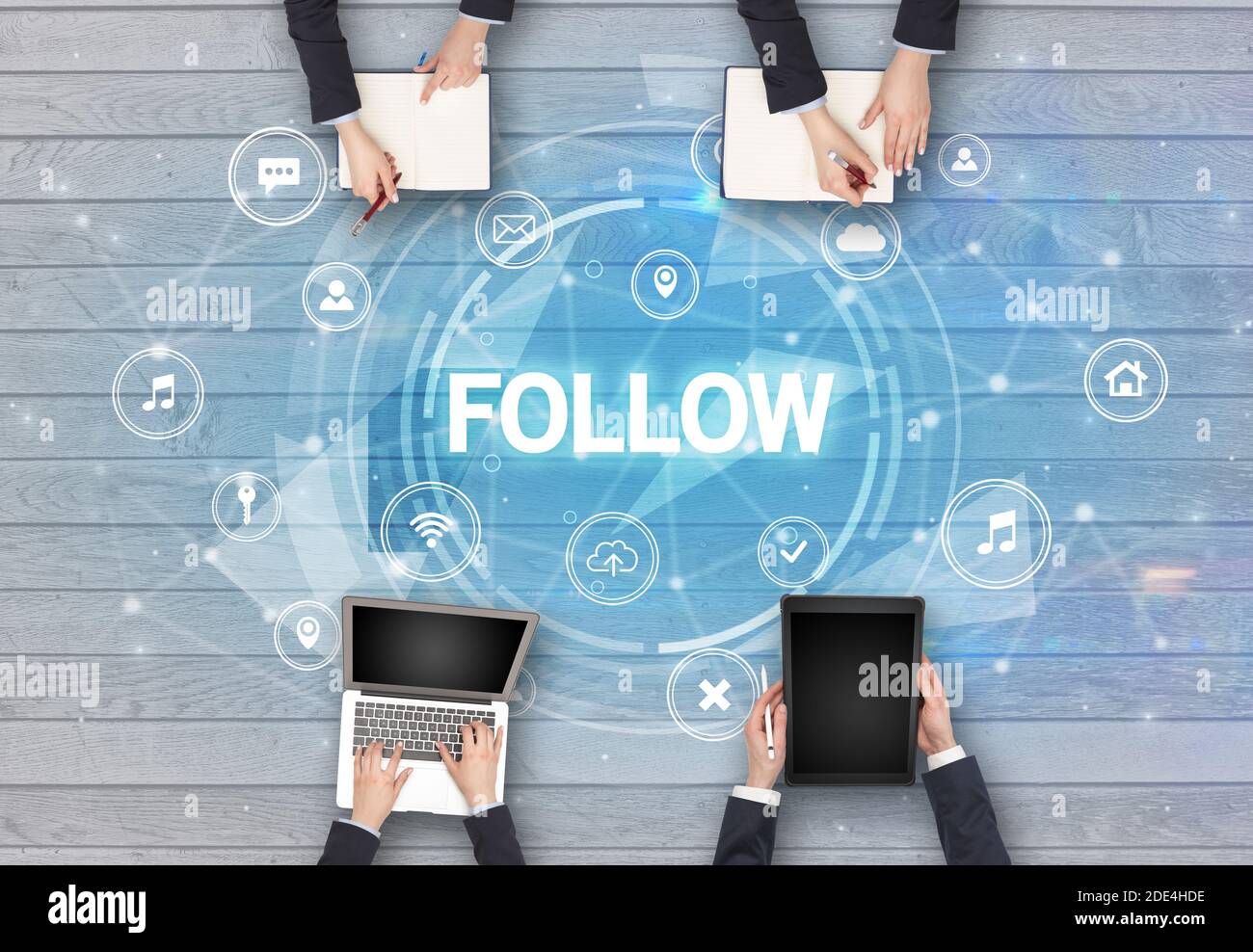 Group of people having a meeting with FOLLOW insciption, social ...