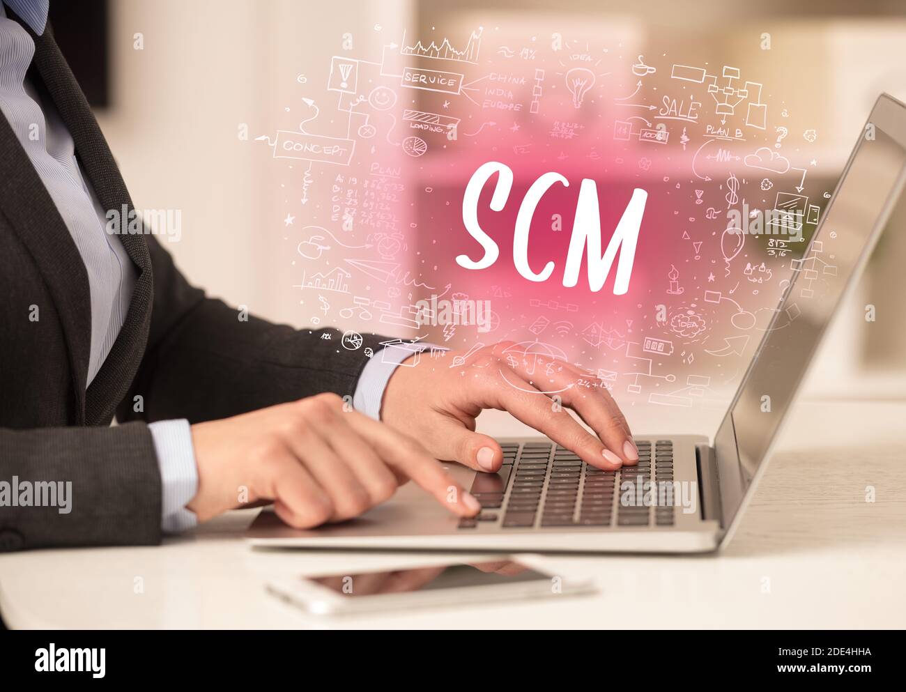 hand working on new modern computer with SCM abbreviation, modern ...