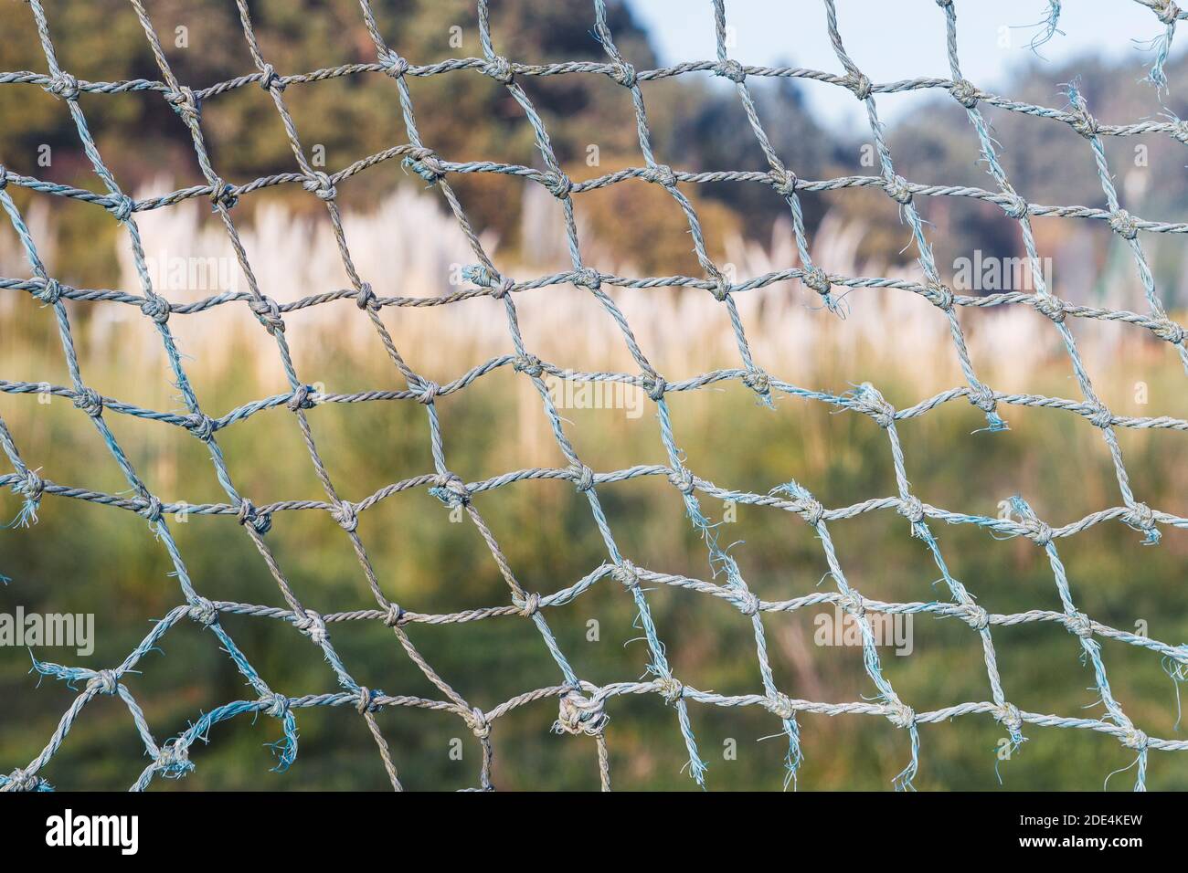 detail of broken net in goal of abandoned soccer field Stock Photo - Alamy