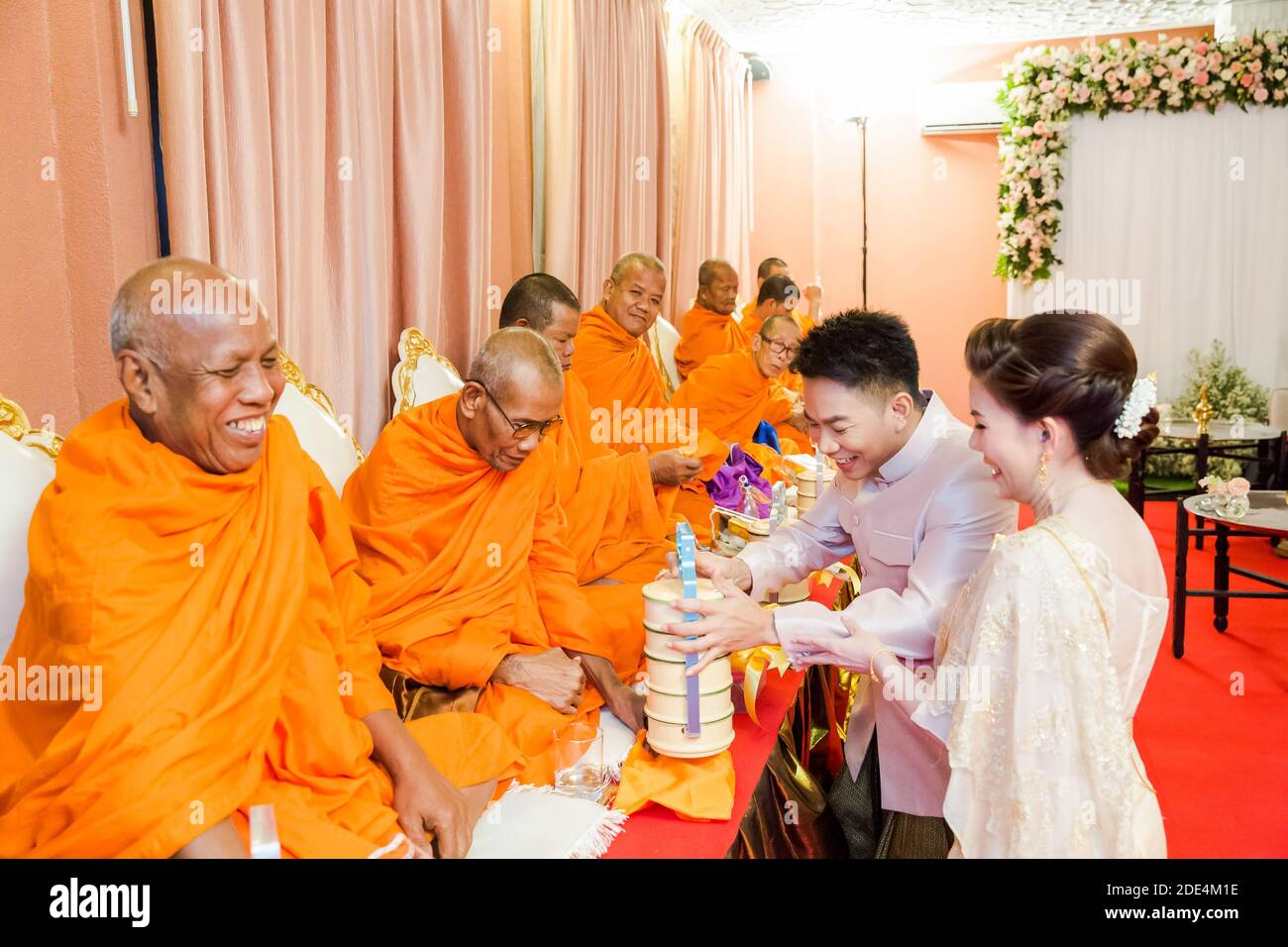 Novenber 11, 2020 - Hua Hin, Thailand : A Thai couple is making merit ...