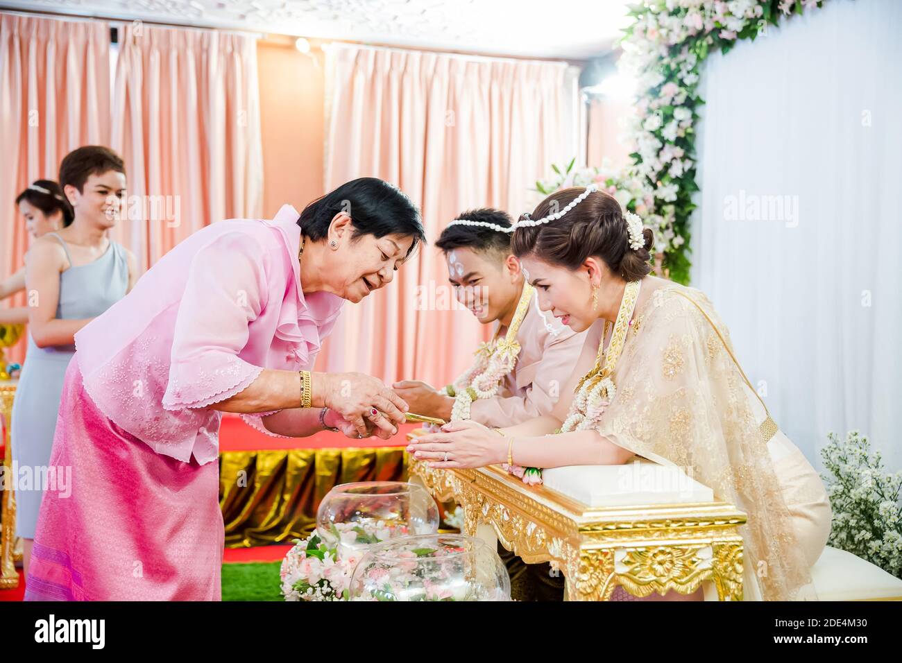 Novenber 11, 2020 - Hua Hin, Thailand : A Thai couple is making merit ...