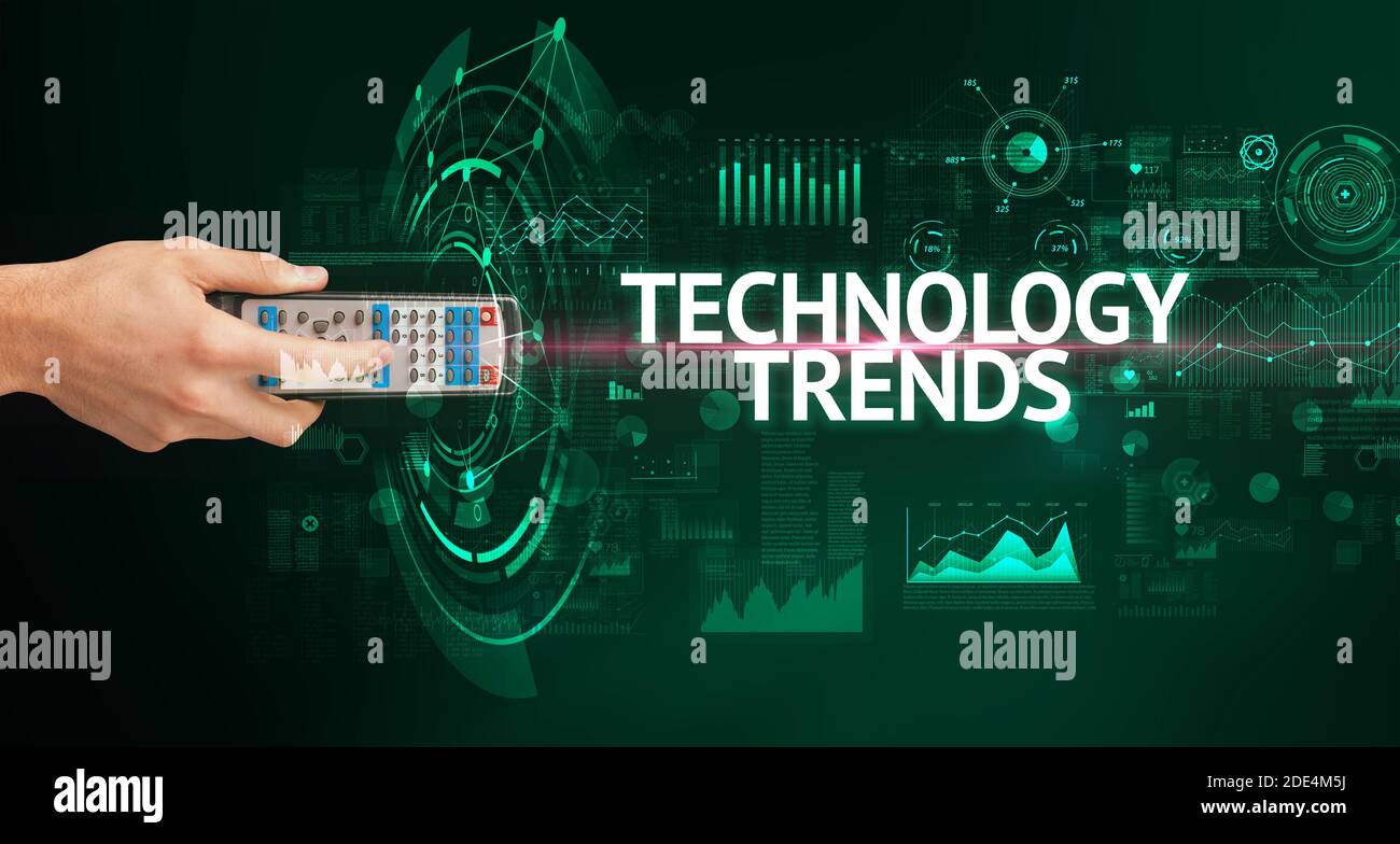 hand holding wireless peripheral with TECHNOLOGY TRENDS inscription ...