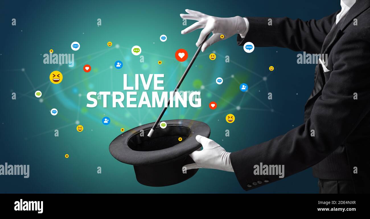 Magician is showing magic trick with LIVE STREAMING inscription, social ...