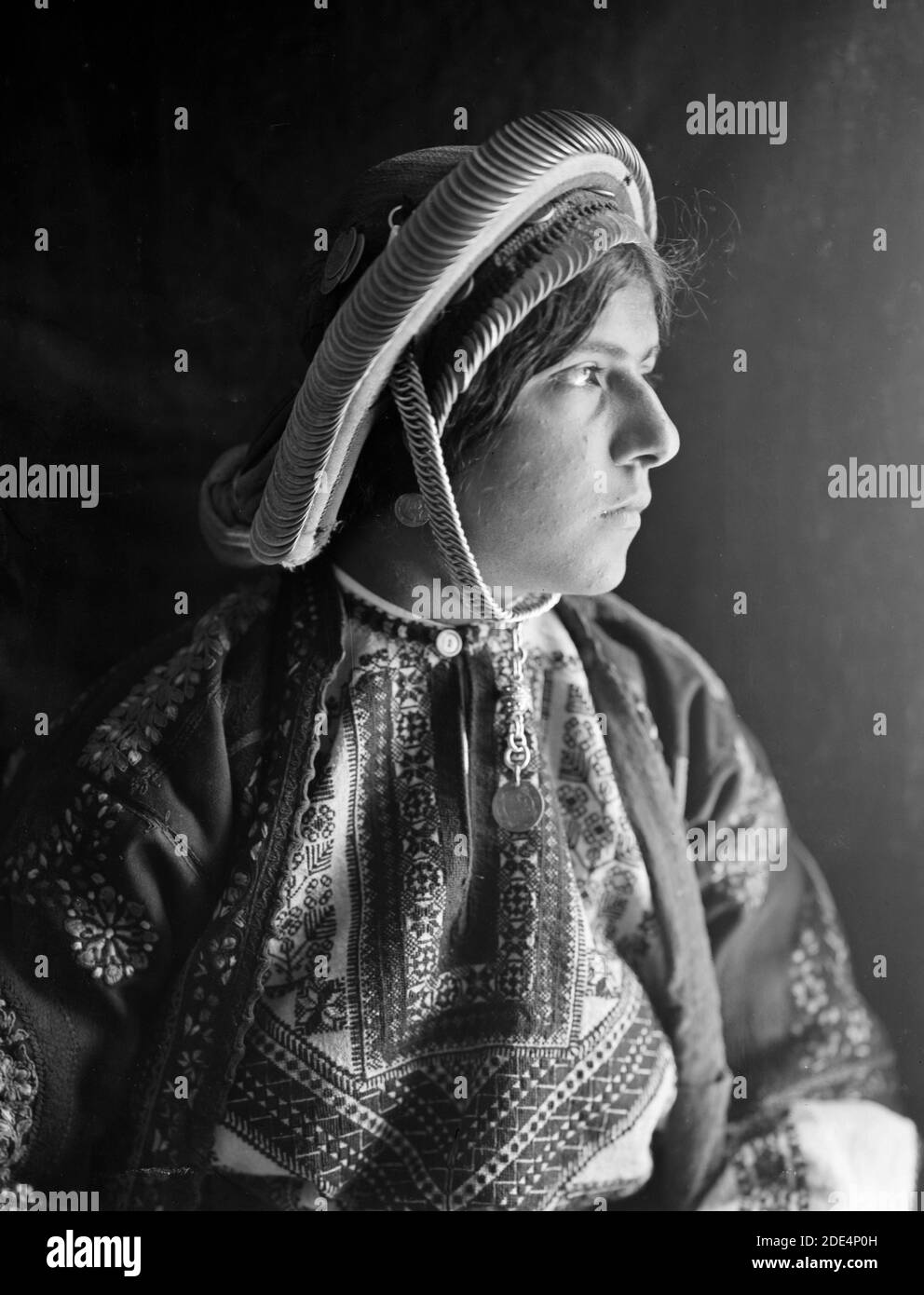 Original Caption: Peasant girl from Ramallah district with dowry coin ...