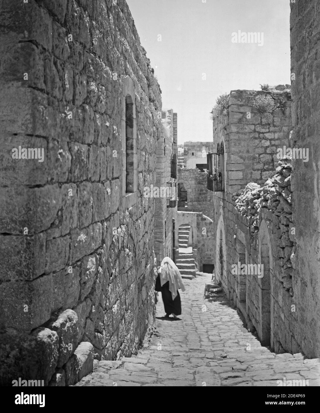Woman walking down bethlehem street hi-res stock photography and images ...