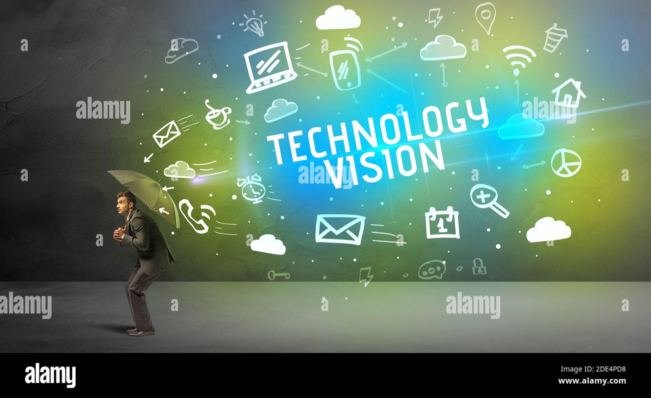 Businessman defending with umbrella from TECHNOLOGY VISION inscription ...