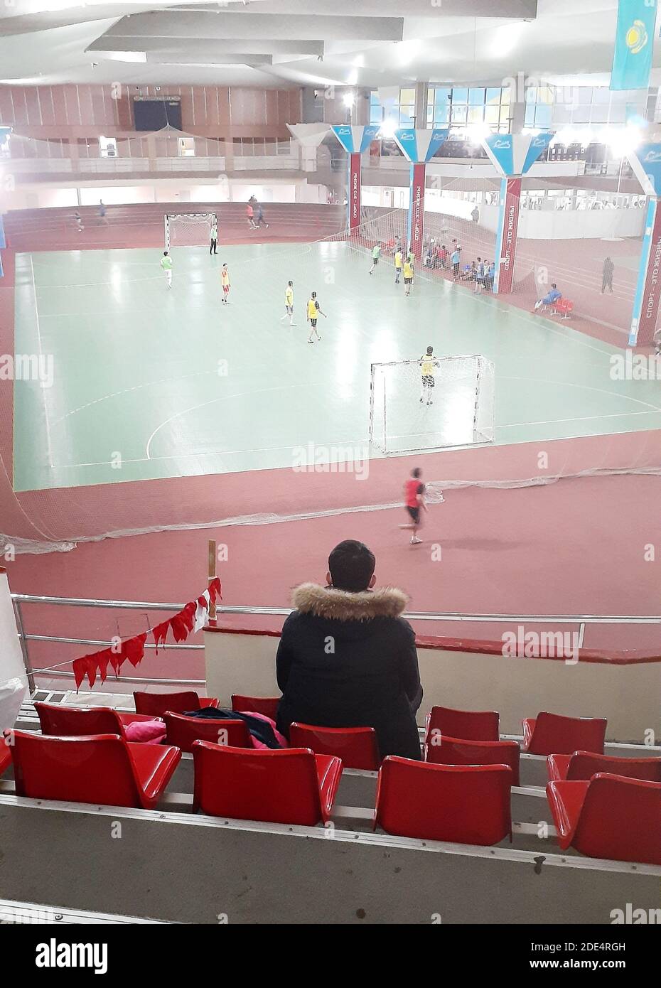 Men playing football in sport hall, soft focus Stock Photo - Alamy