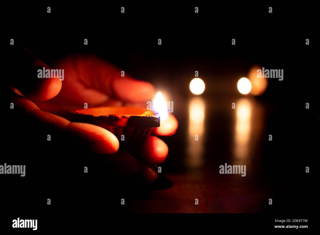Person holding diya with hands during the Indian festivals. Karthigai ...