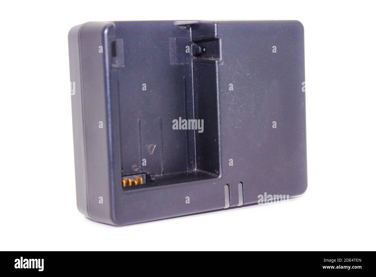 DSLR camera battery charger on white background Stock Photo - Alamy