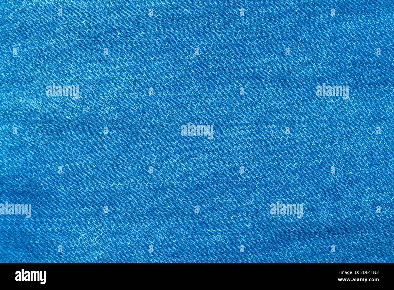 Blue color denim jeans clothes textured background Stock Photo - Alamy