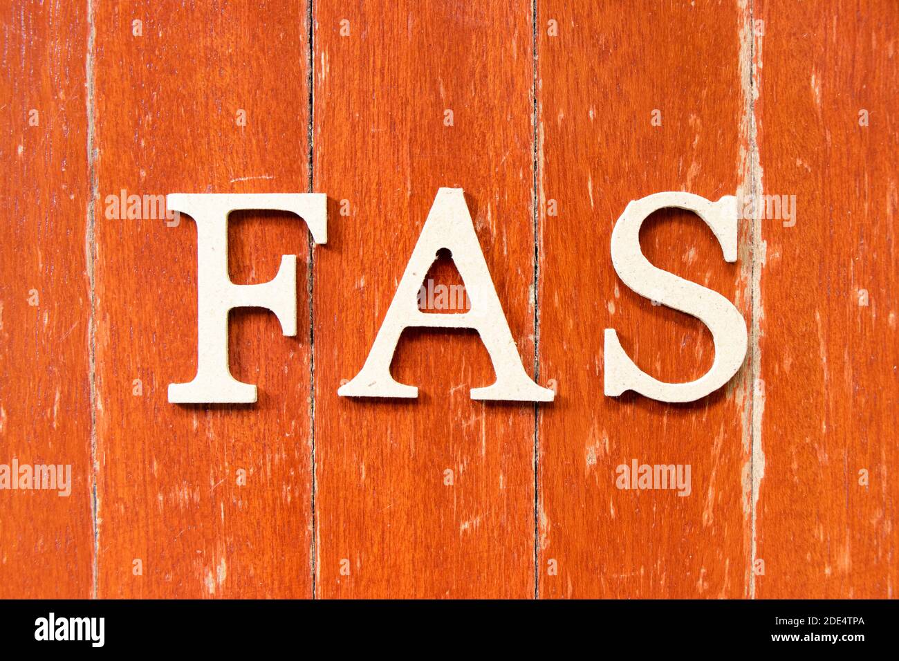 Alphabet letter in word FAS (abbreviation of Free alongside) on old red ...