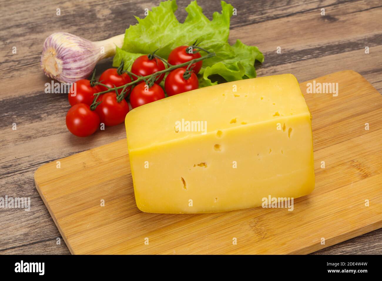 Swiss Hard yellow tasty cheese brick Stock Photo - Alamy