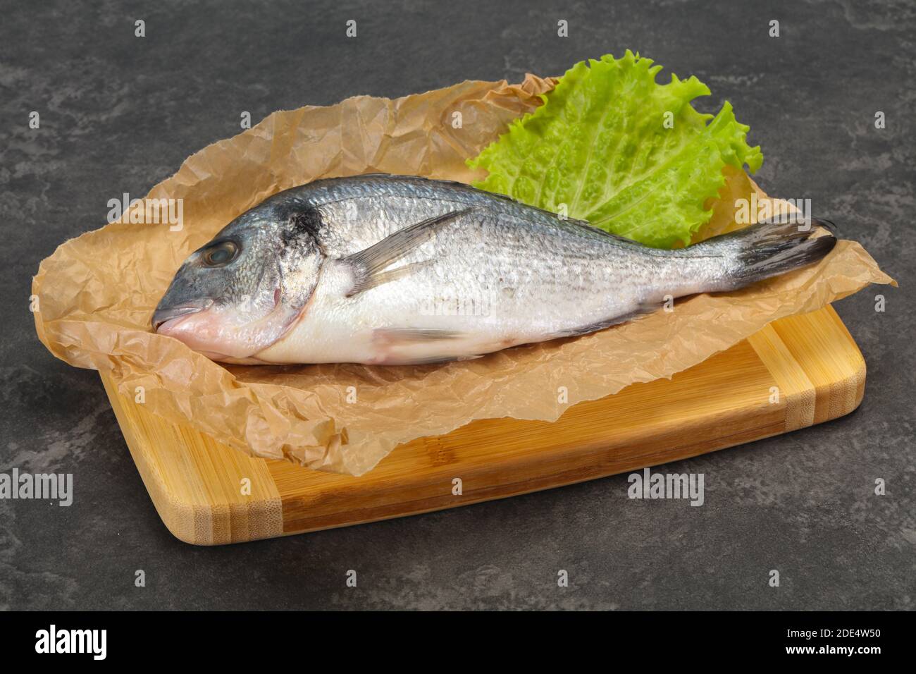 Raw Dorada fish ready for cooking Stock Photo - Alamy