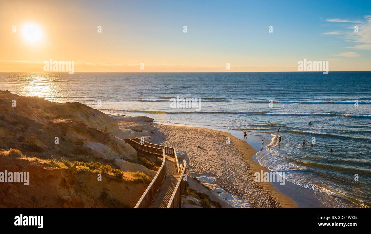 South Port beach with people at Port Noarlunga during sunset Stock ...