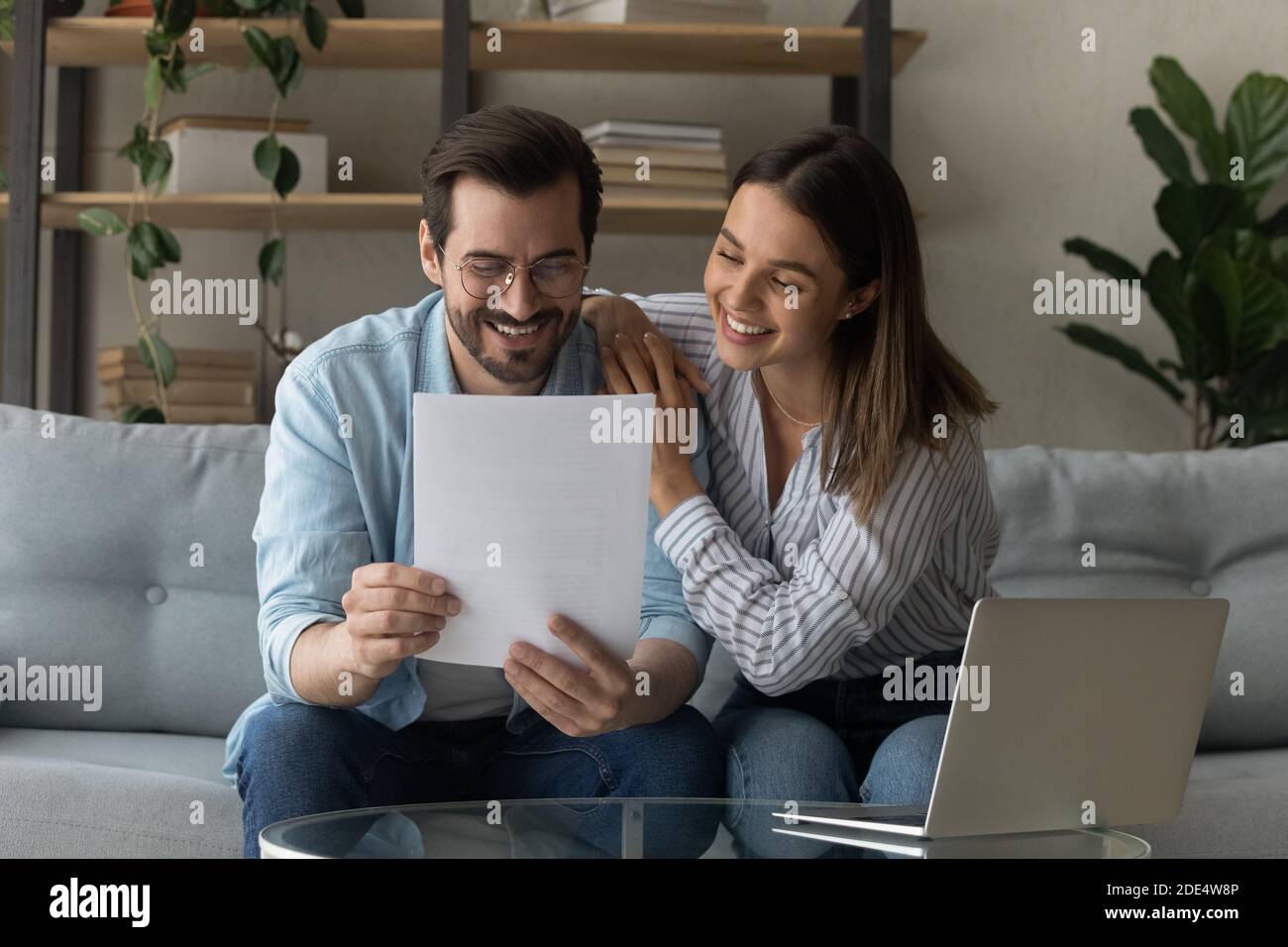 Excited young family couple read hi-res stock photography and images ...