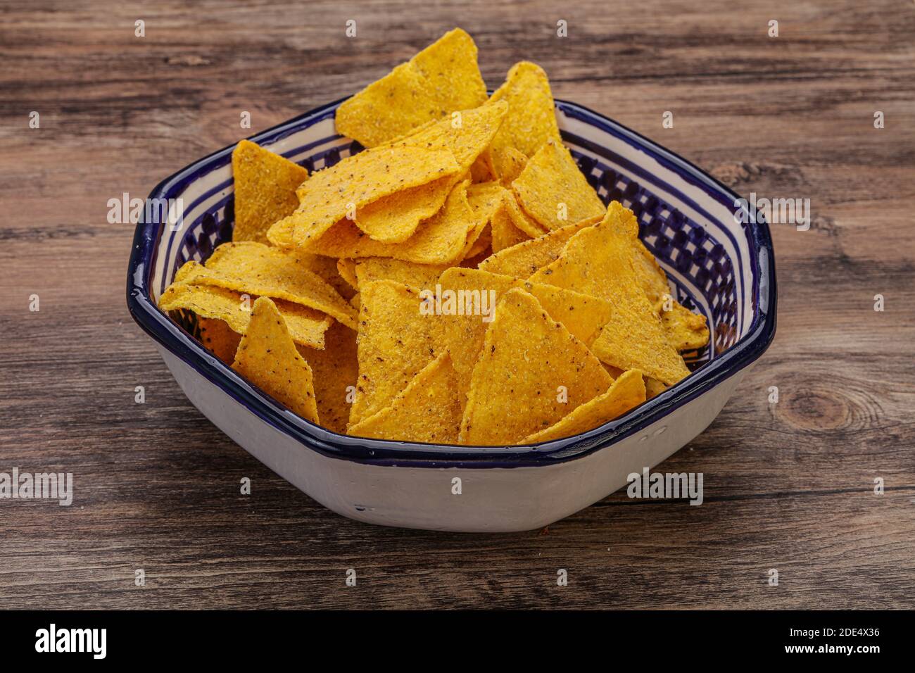 Mexican crunchy corn nachos triangle heap Stock Photo - Alamy