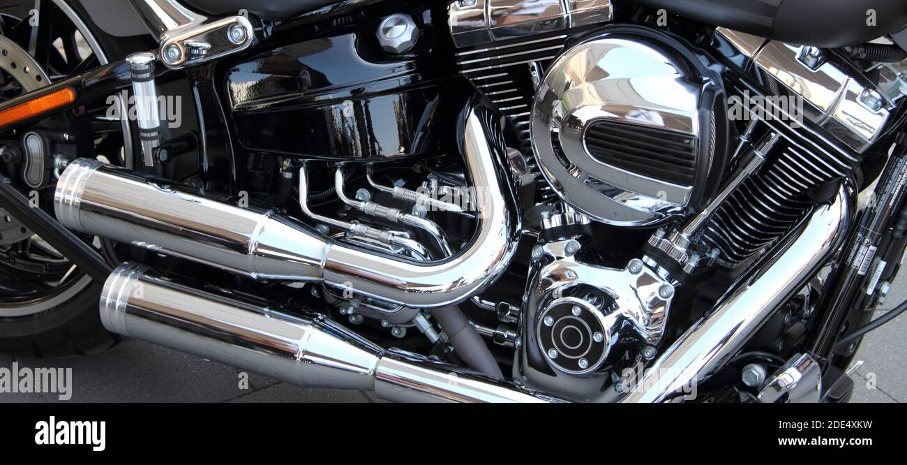 an engine block with exhaust from a motorcycle Stock Photo - Alamy