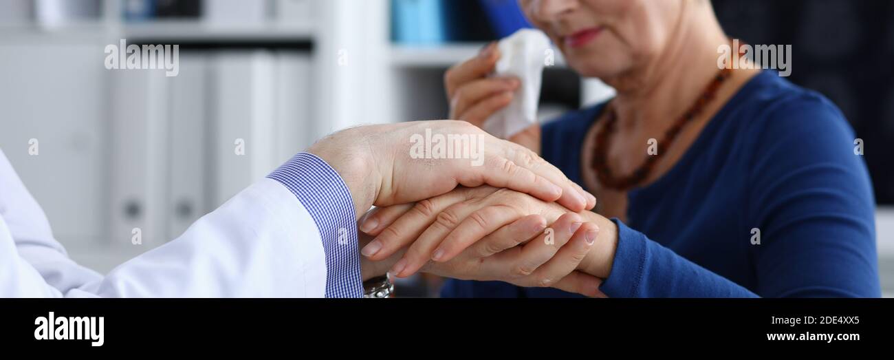 An elderly woman cries at doctor's appointment Stock Photo - Alamy