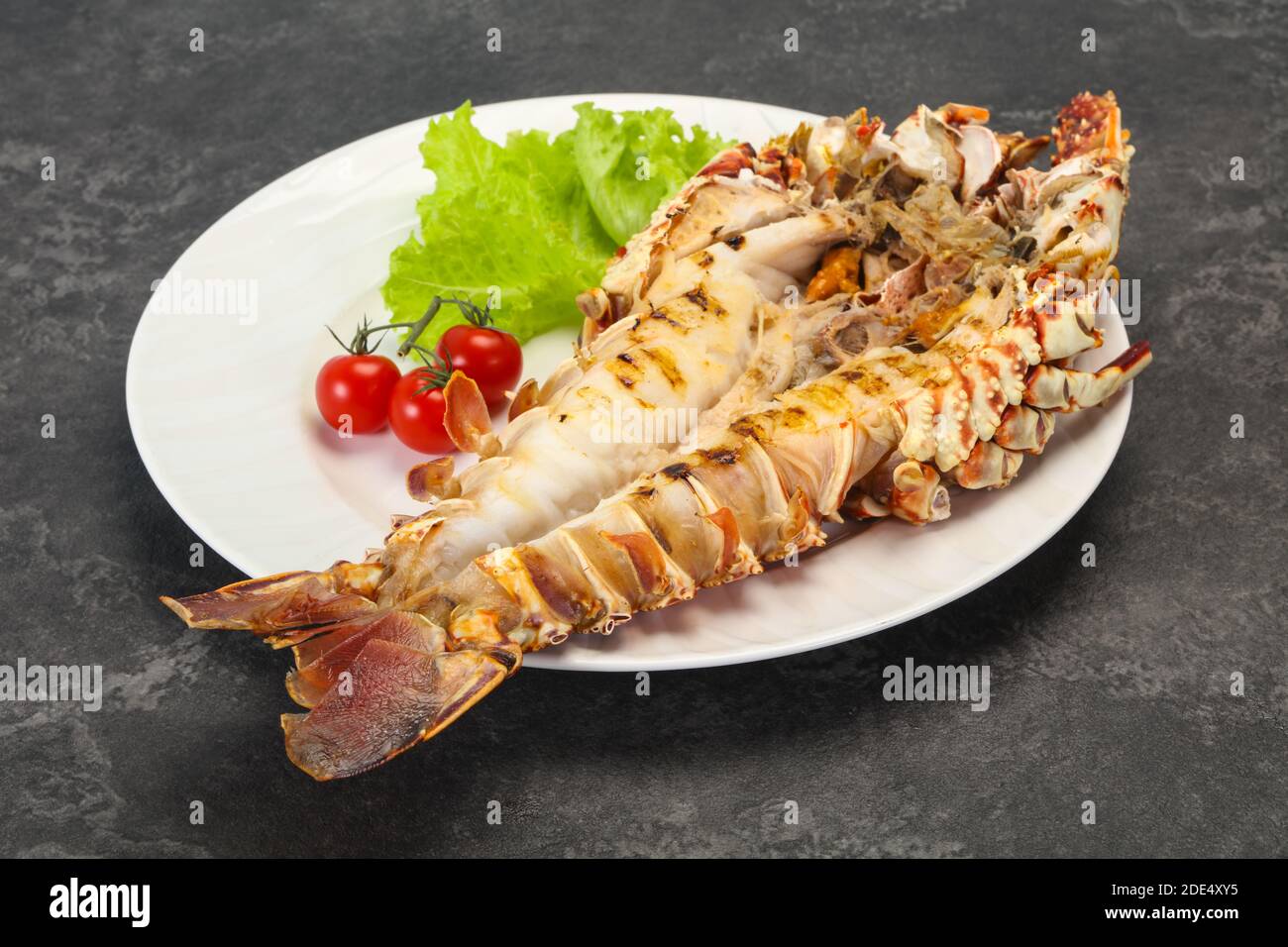 Grilled crayfish in the plate served salad Stock Photo - Alamy
