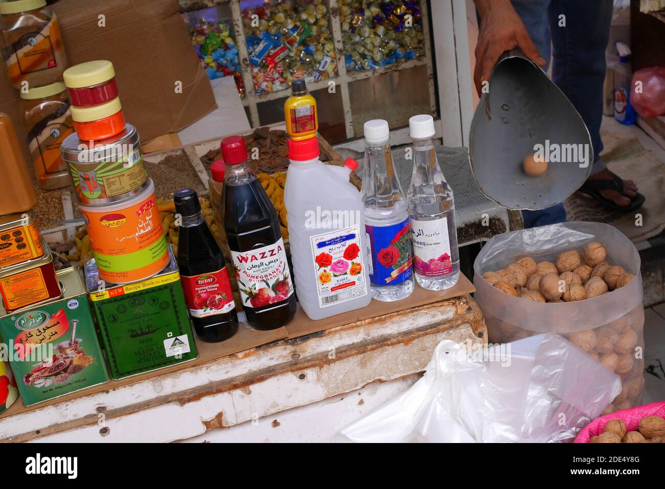 Vendor at the Manama Souk selling walnuts, Manama, Kingdom of Bahrain ...