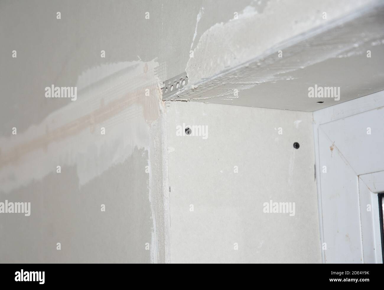 Close up on gypsum plasterboard plastering on window corner problem ...
