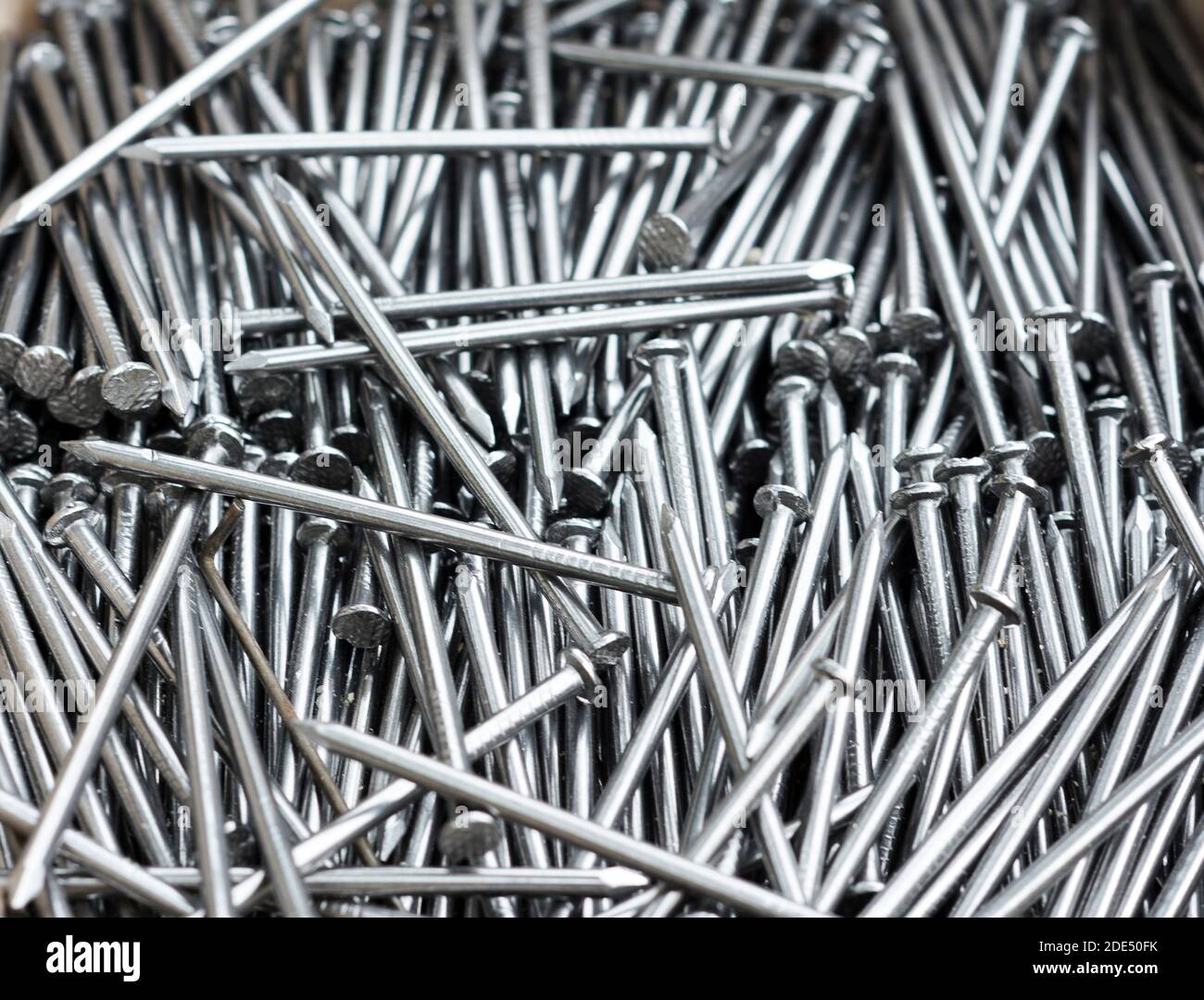 Nails textured background. Stack of metal nails Stock Photo - Alamy