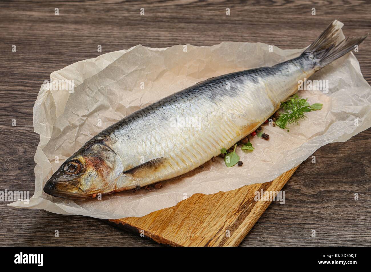 Salted Herring fish with pepper and spices Stock Photo - Alamy