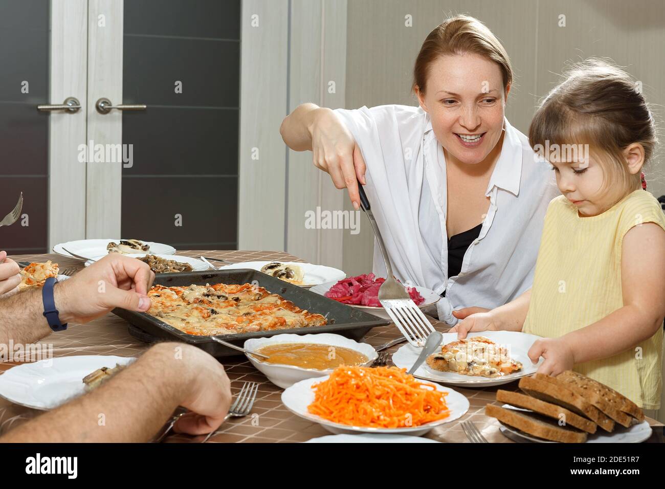 family dinner lifestyle. happy caucasian family eating homemade food ...