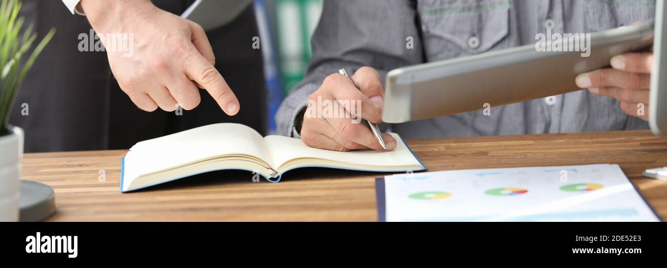 Close up of male hand that pointing at notes Stock Photo - Alamy