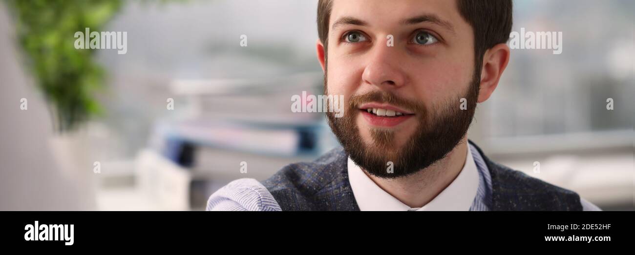 Kind young man looking at his interlocutor Stock Photo - Alamy