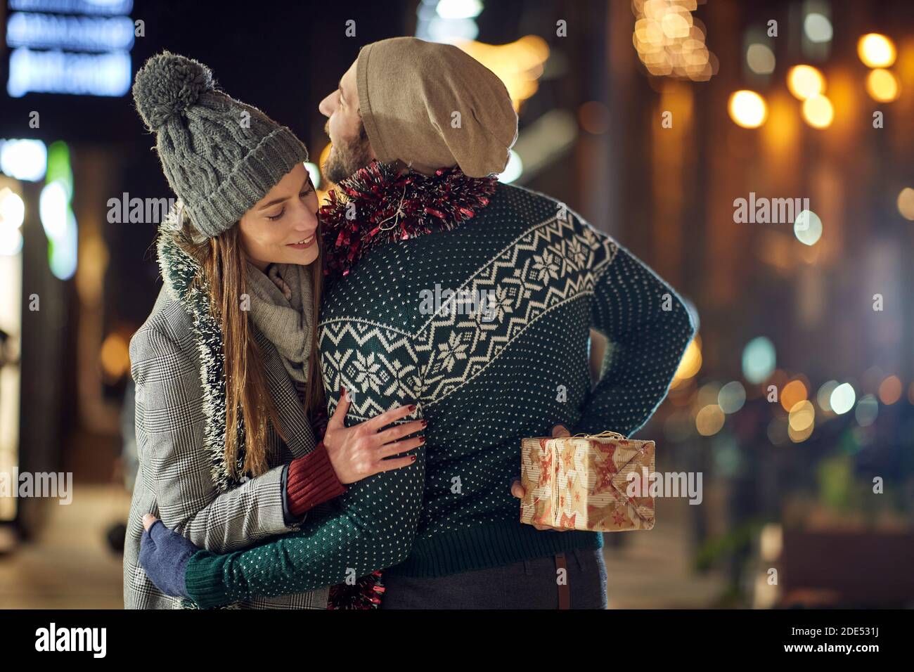 A boyfriend hides Xmas present for his girlfriend while walking the ...