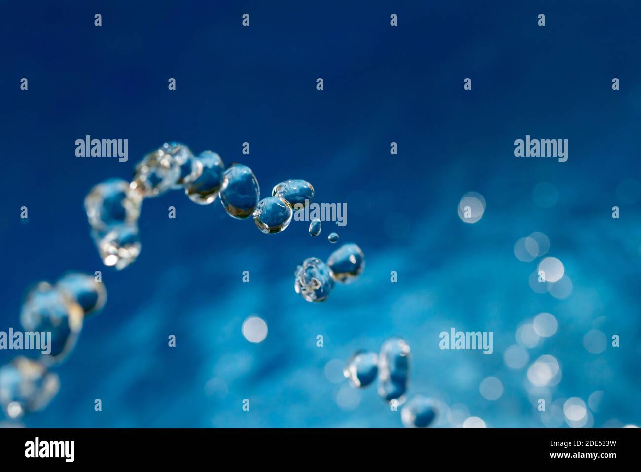 a image of water droplets in mid-air air on a fountain water feature ...