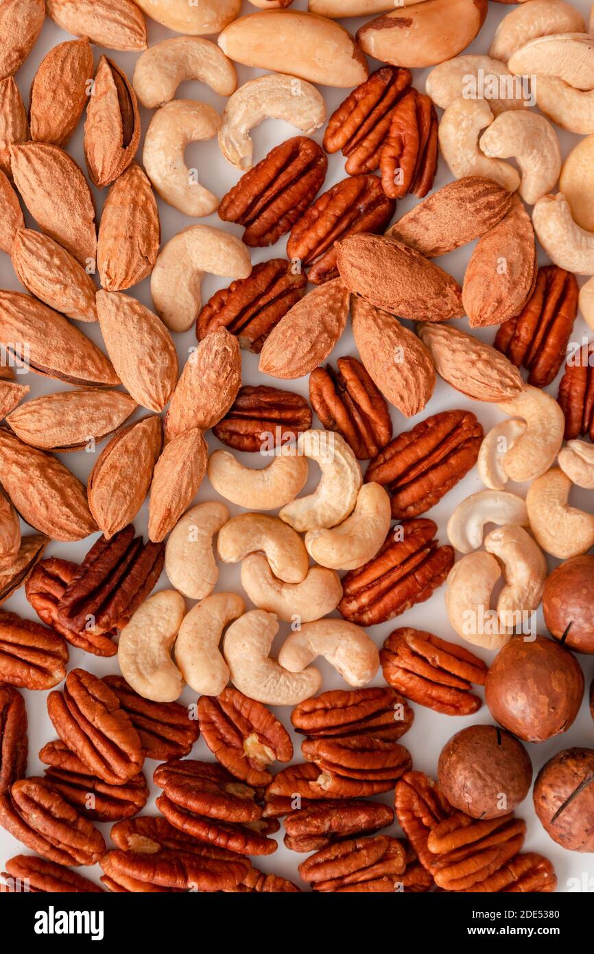 Proper nutrition composition of assorted nuts pattern vertical photo ...