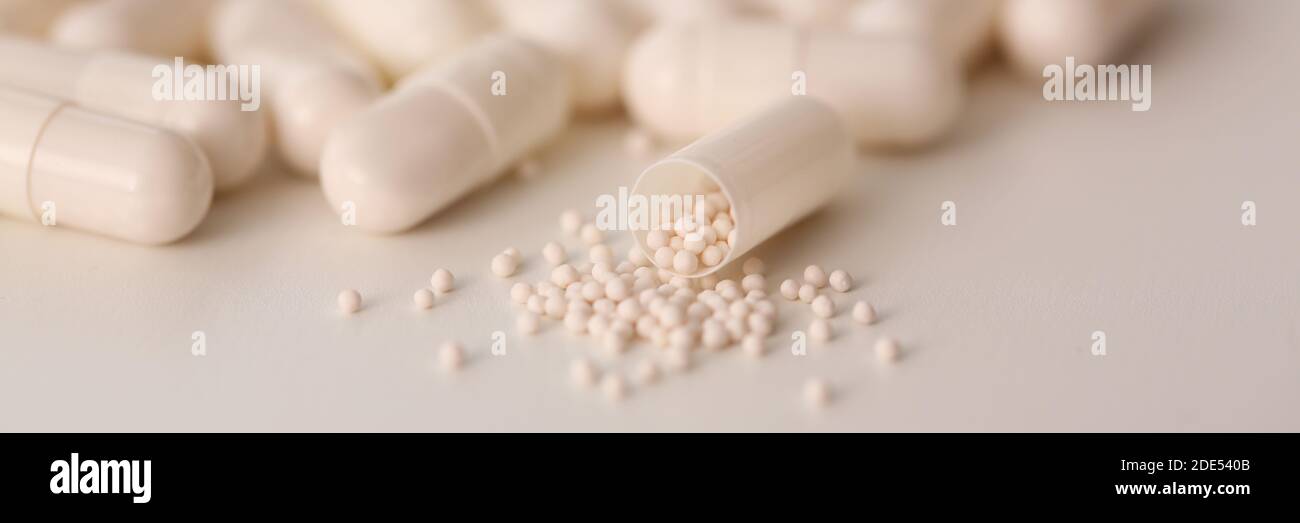 Macro photo of white pills that lying on paper Stock Photo - Alamy