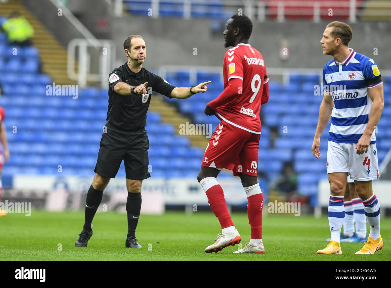 referee Jeremy Simpson tells Famara Diedhiou #9 of Bristol City thats ...