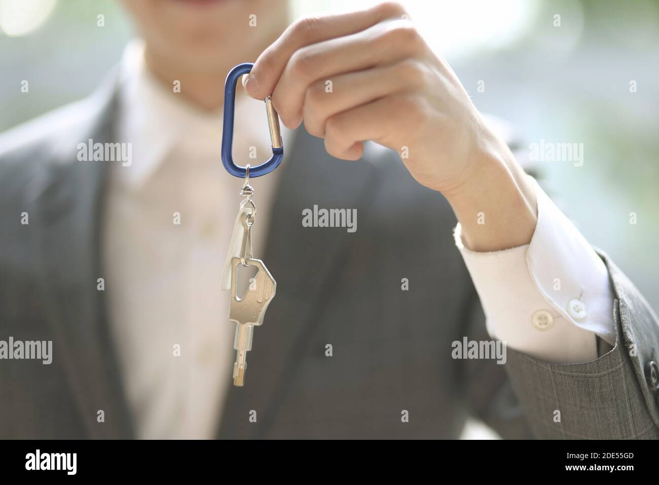 Businessman holding key hi-res stock photography and images - Alamy