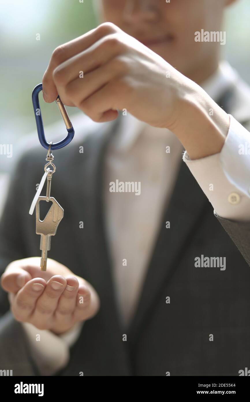 Businessman holding key hi-res stock photography and images - Alamy